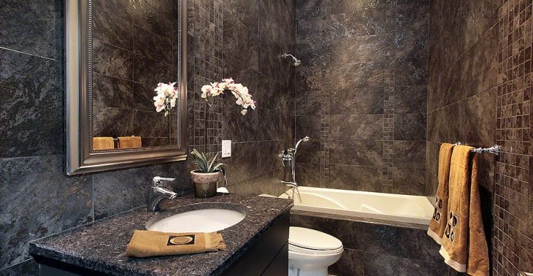 Powder room with black granite walls | DSI Contractors